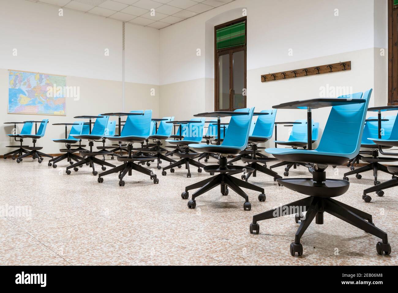 social distancing between school desks in an empty classroom ...