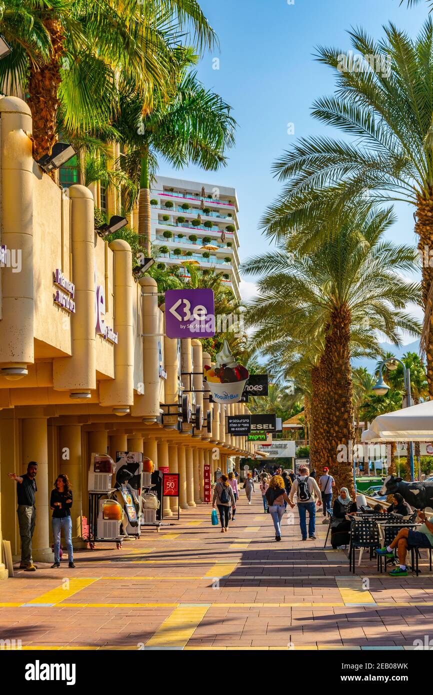 EILAT, ISRAEL, DECEMBER 30, 2018: People are strolling on seaside ...