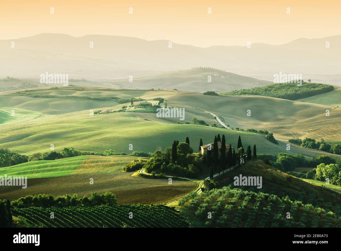 Tuscany landscape at sunrise. Typical for the region tuscan farm house ...