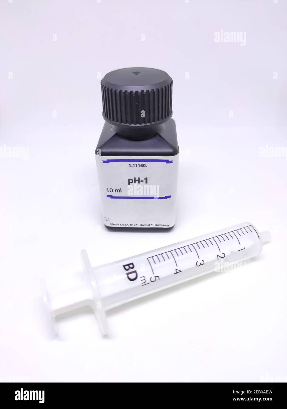 Closeup shot of water testing sample reagents with a syringe on the ...