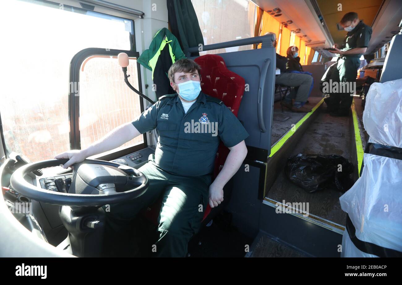 Paramedic Alan Martin who is also the coach driver sits in the drivers ...
