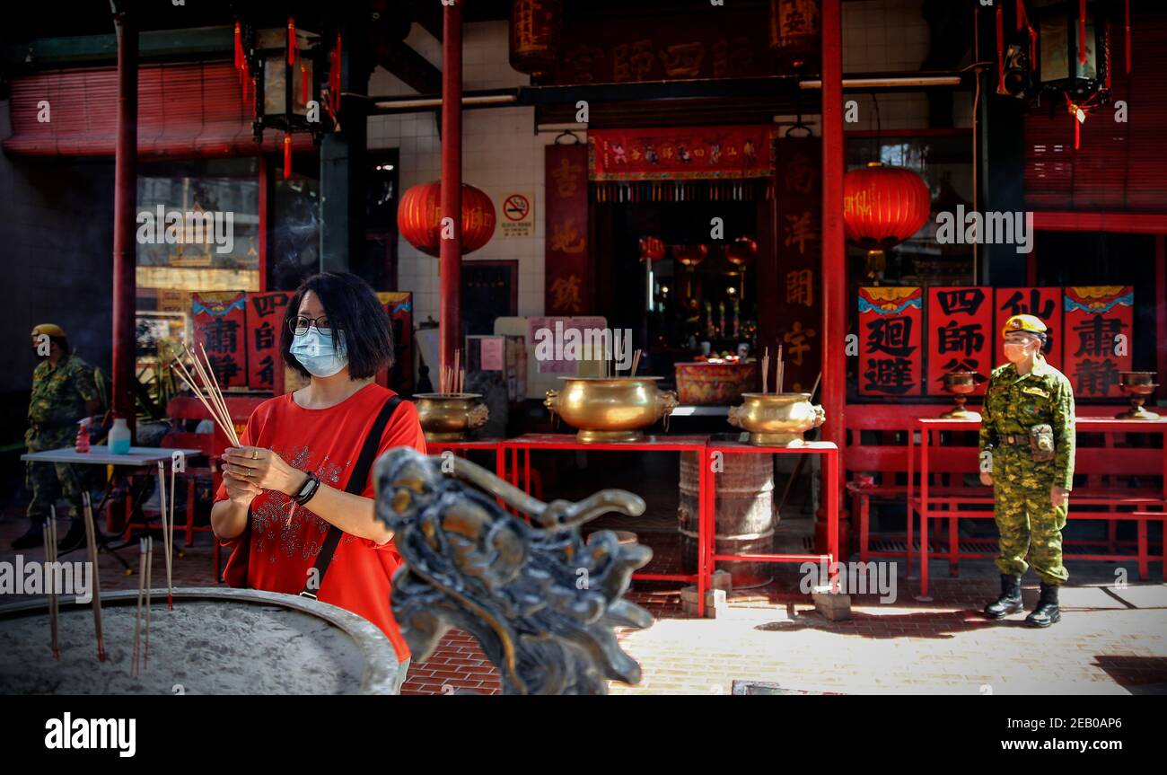 Malaysian ethnic Chinese wearing a face mask as a precaution against ...
