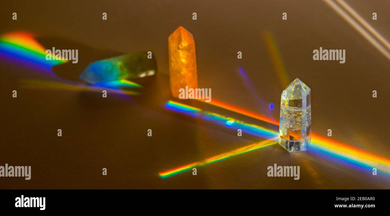 Healing chakra crystals and rainbow on beige background. Meditation ...