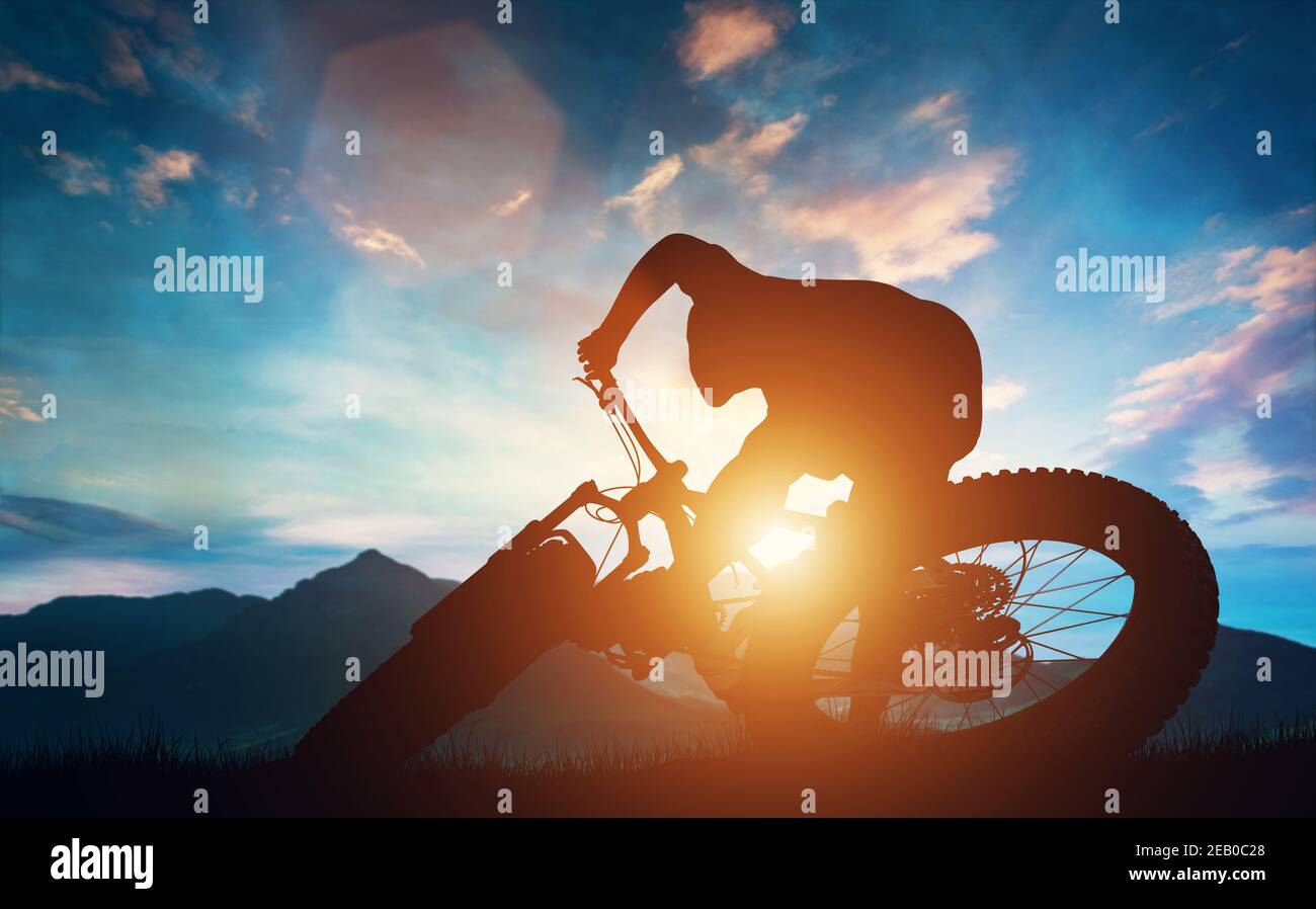 Man riding his bike in mountains during sunset. Cycling, biking and ...