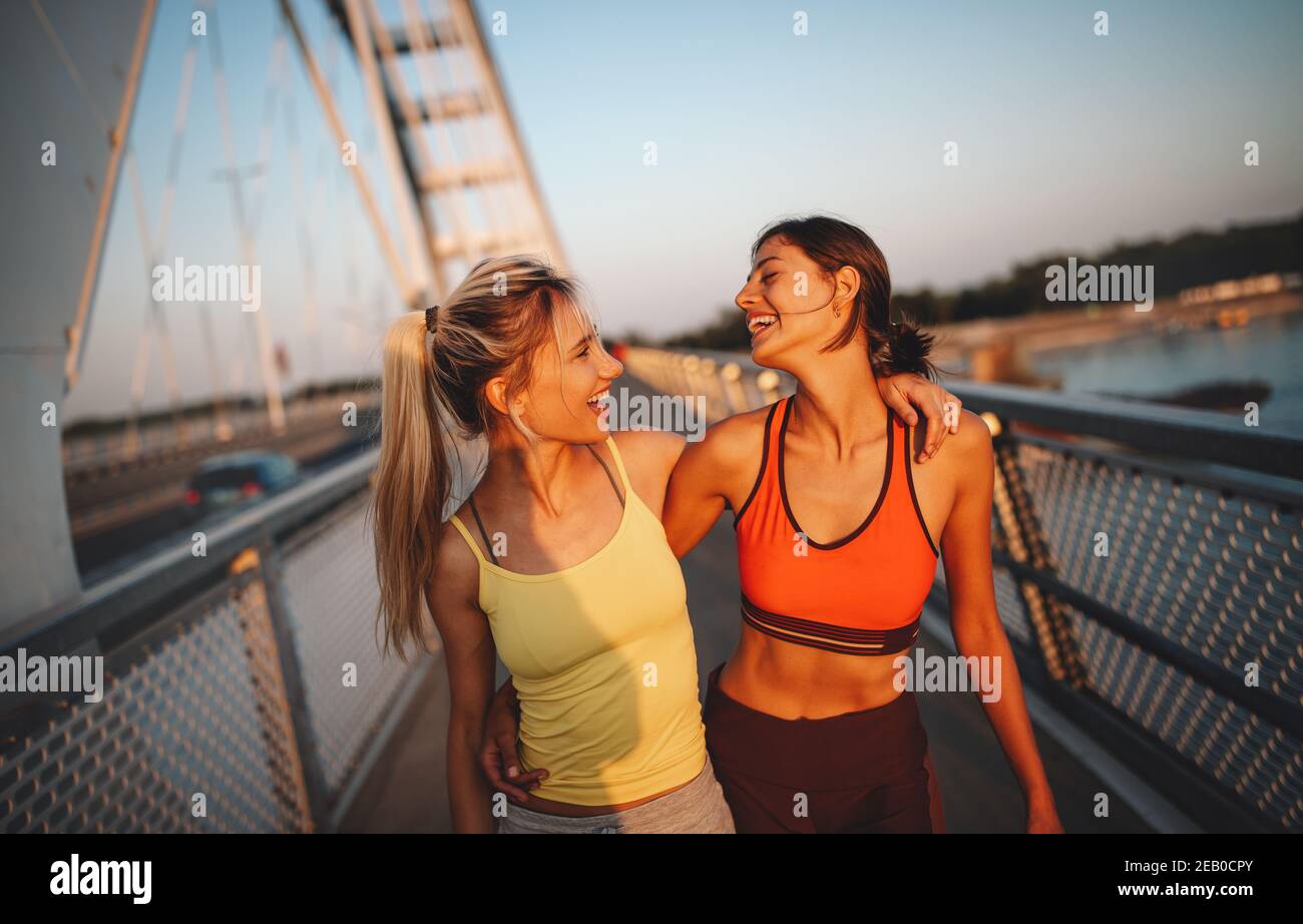 Fitness, sport, people and running concept. Happy fit friends running ...