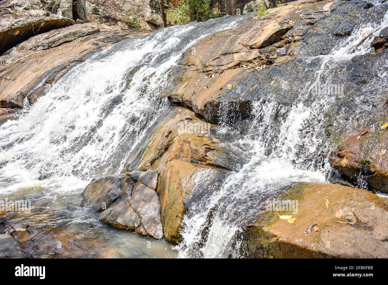 Small waterfall flowing on above big rock in famous place near ...