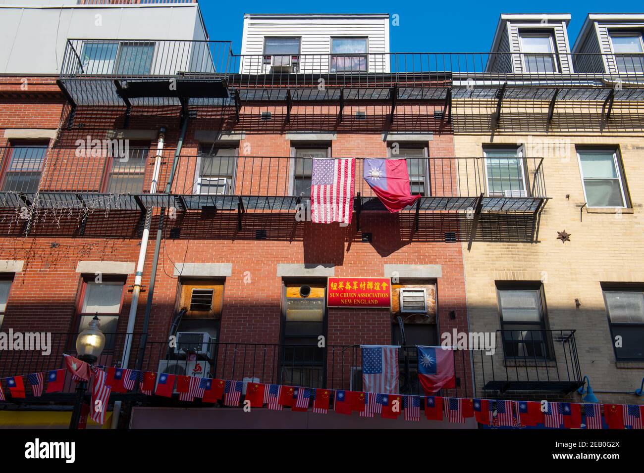 Historic commercial buildings at 52 Beach Street with Flag of USA and ...