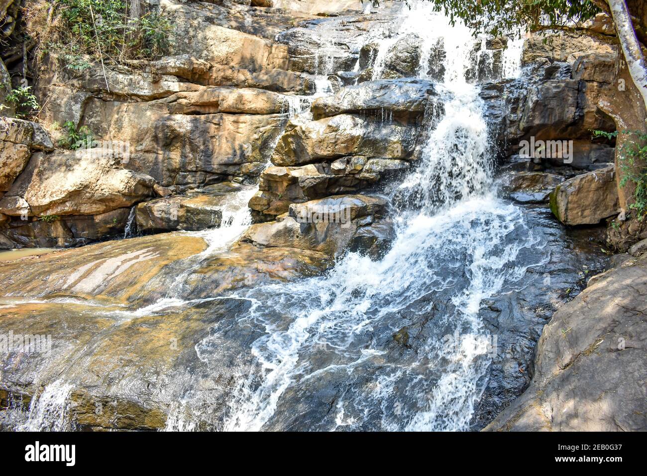 Small waterfall flowing on above big rock in famous place near ...
