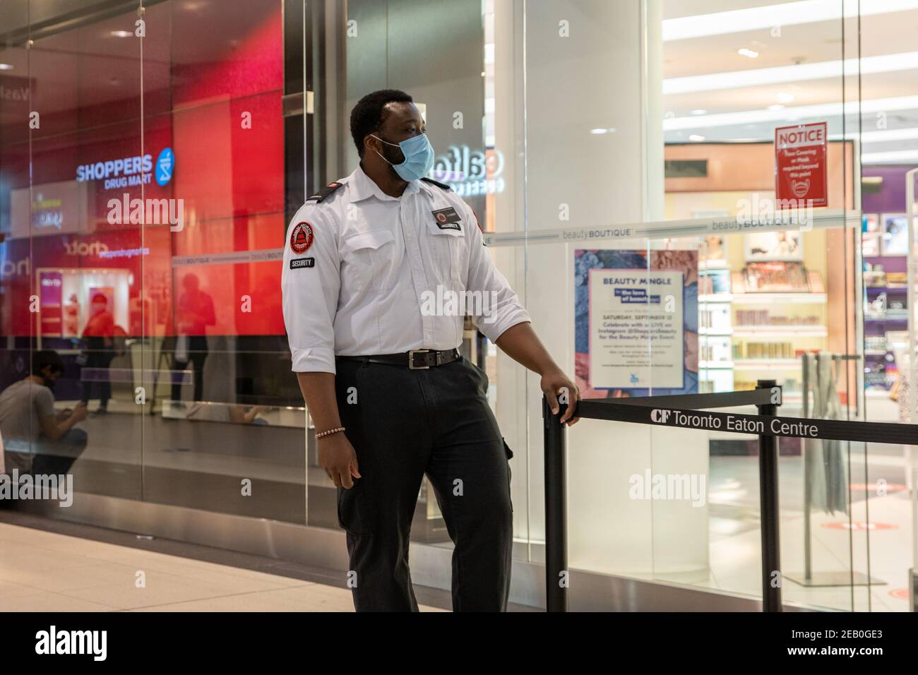 People wear face masks in mall during COVID-19 pandemic Stock Photo - Alamy