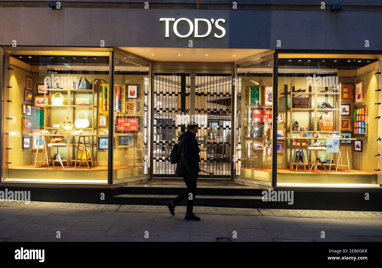 London, UK. 10th Feb, 2021. A man walking past the TOD's in London ...
