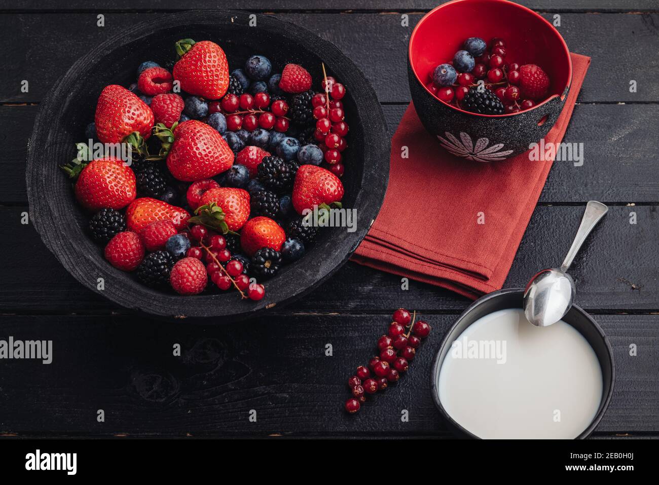 Healthy breakfast eating a mix of fresh berries fruits Stock Photo - Alamy