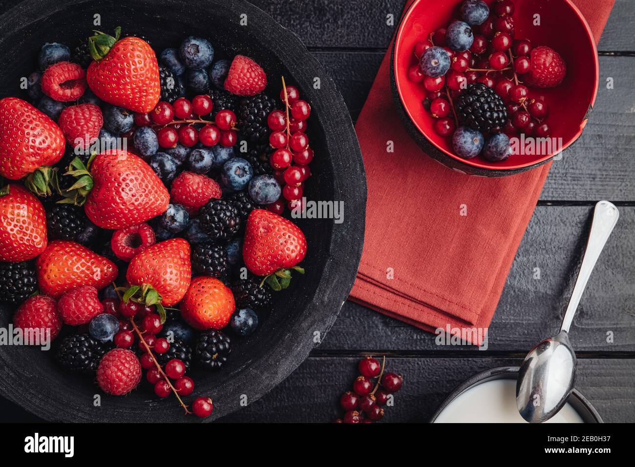 Healthy breakfast eating a mix of fresh berries fruits Stock Photo - Alamy
