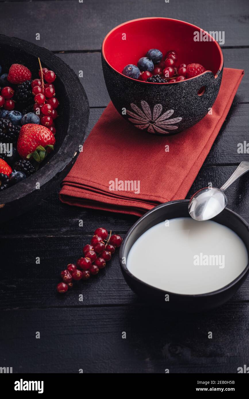 Healthy breakfast eating a mix of fresh berries fruits Stock Photo - Alamy