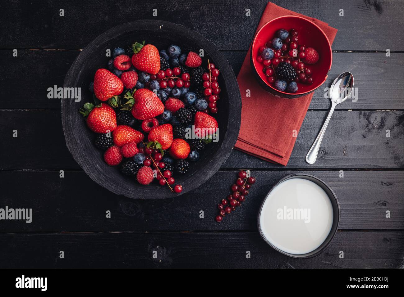 Healthy breakfast eating a mix of fresh berries fruits Stock Photo - Alamy