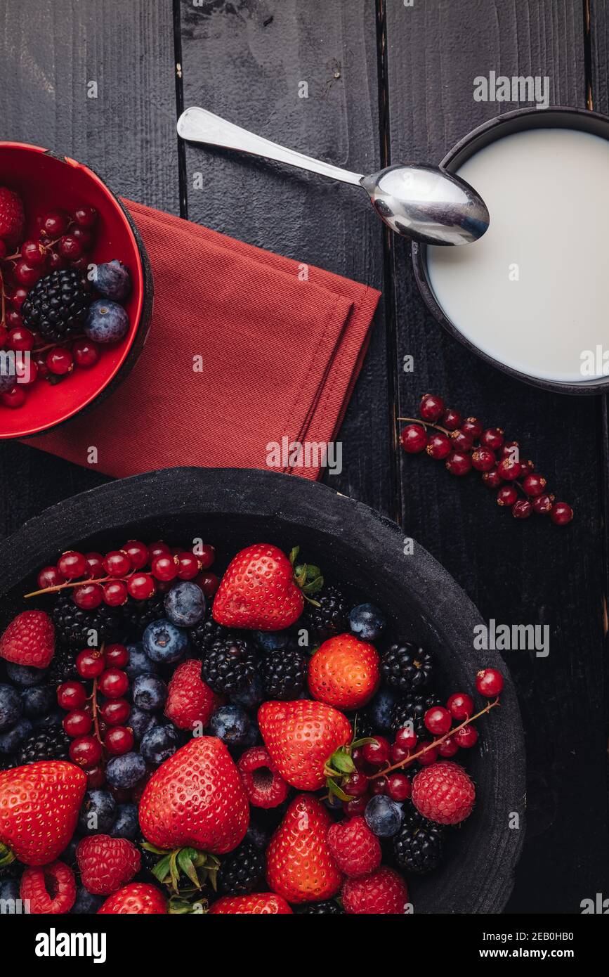 Healthy breakfast eating a mix of fresh berries fruits Stock Photo - Alamy