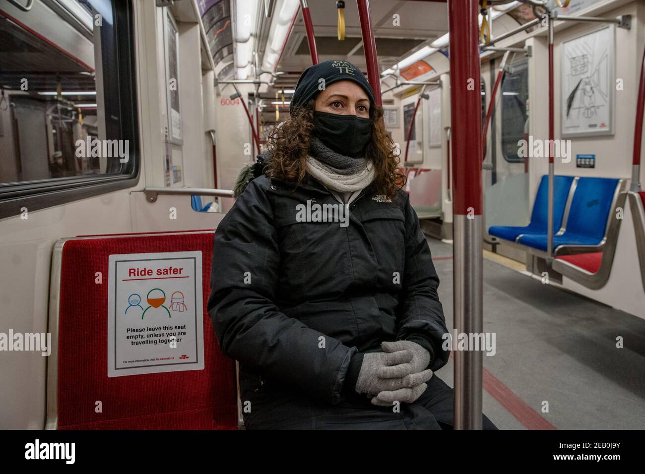 Person wears face mask on subway during COVID-19 pandemic Stock Photo ...