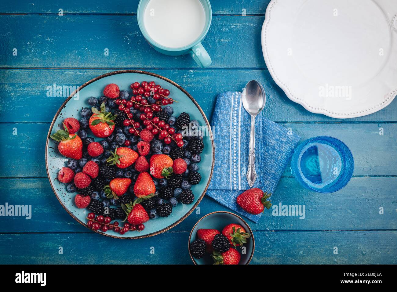 Healthy breakfast eating a mix of raw fresh berries fruits Stock Photo ...