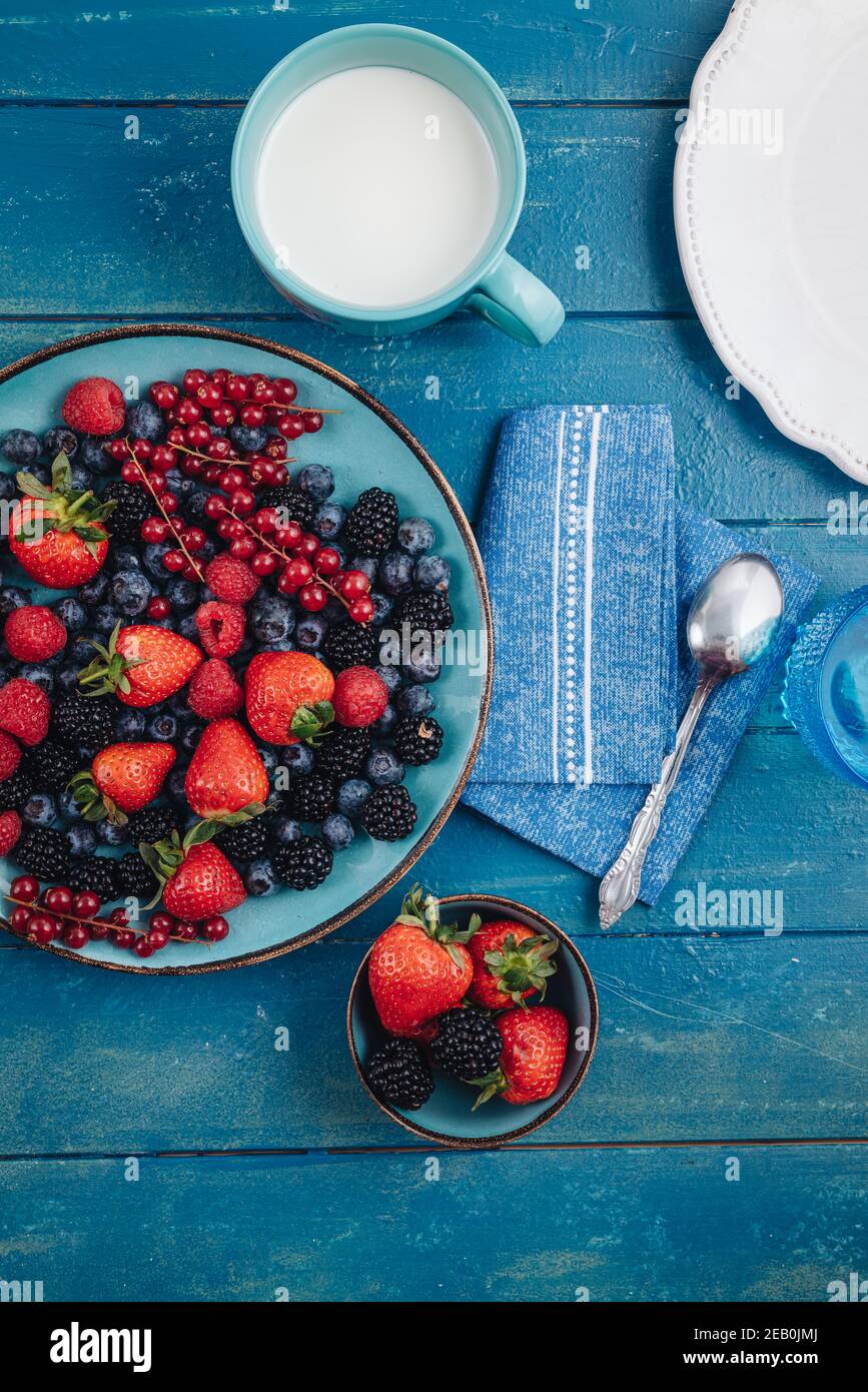 Healthy breakfast eating a mix of raw fresh berries fruits Stock Photo ...
