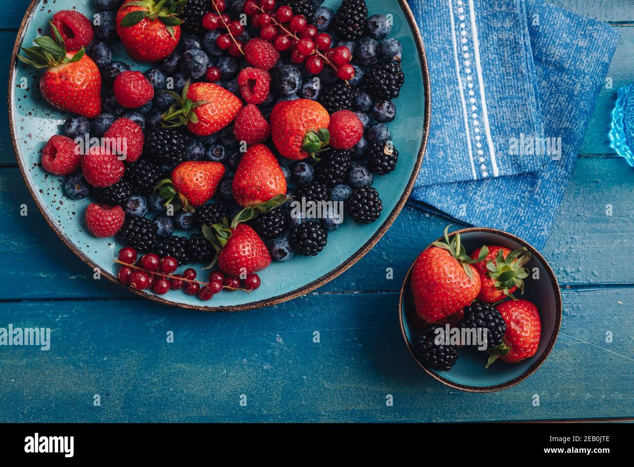 Healthy breakfast eating a mix of raw fresh berries fruits Stock Photo ...