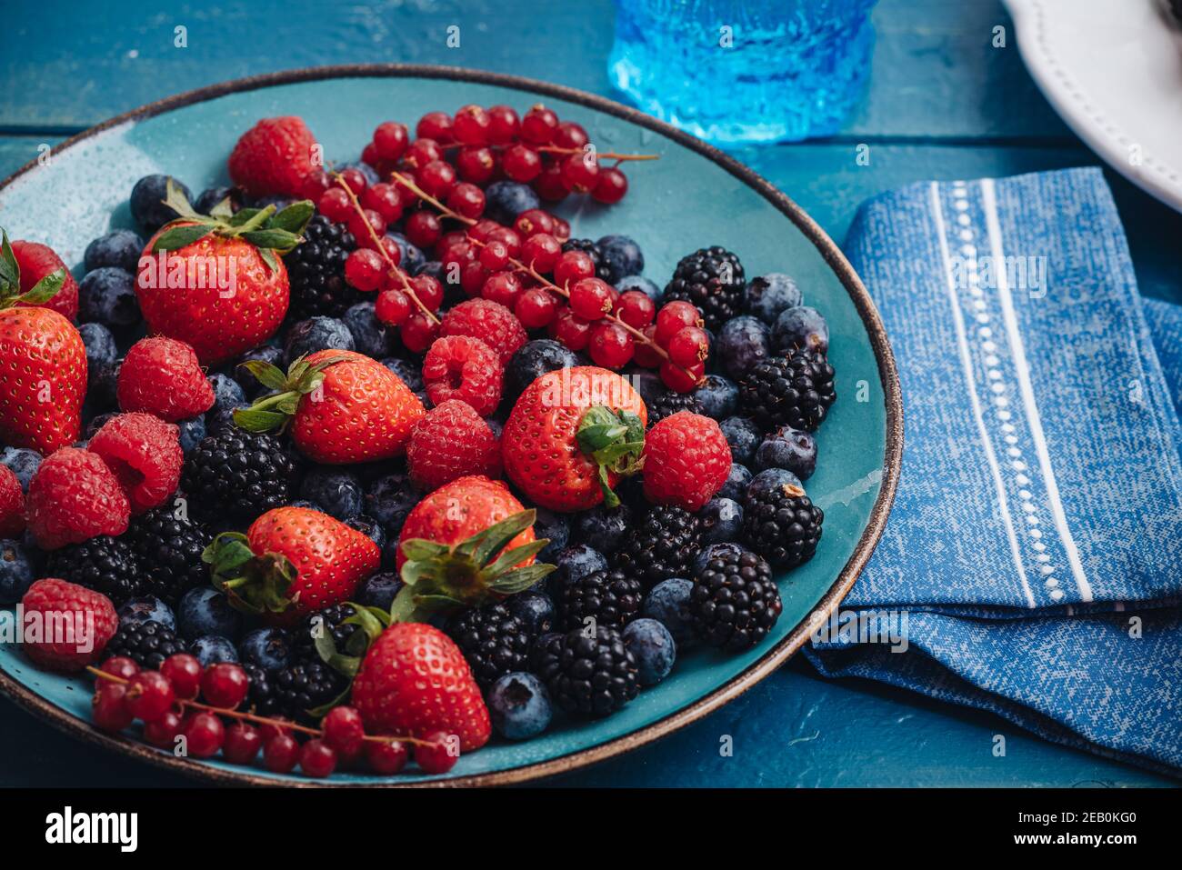 Healthy breakfast eating a mix of raw fresh berries fruits Stock Photo ...