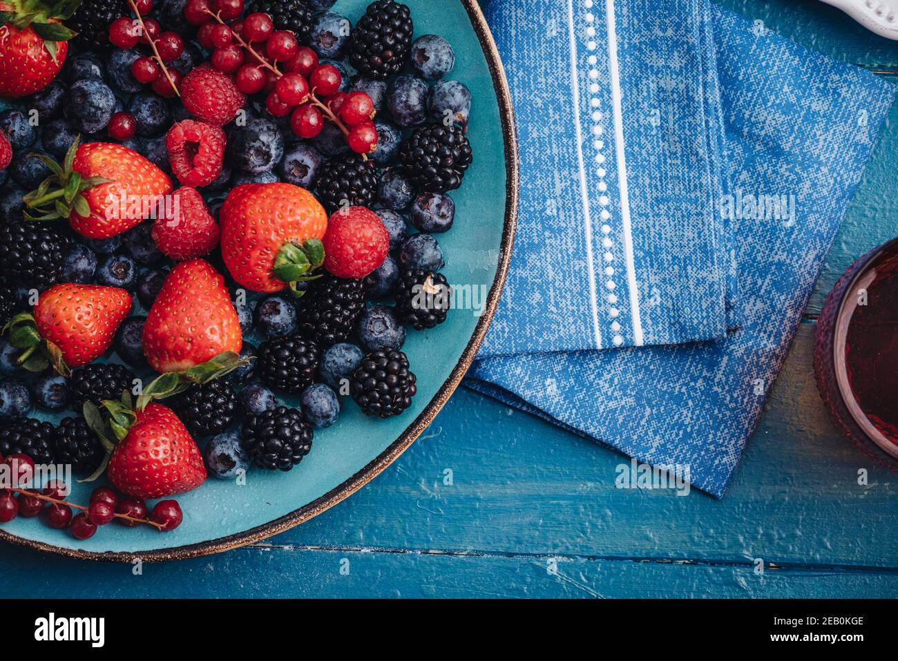 Healthy breakfast eating a mix of raw fresh berries fruits Stock Photo ...
