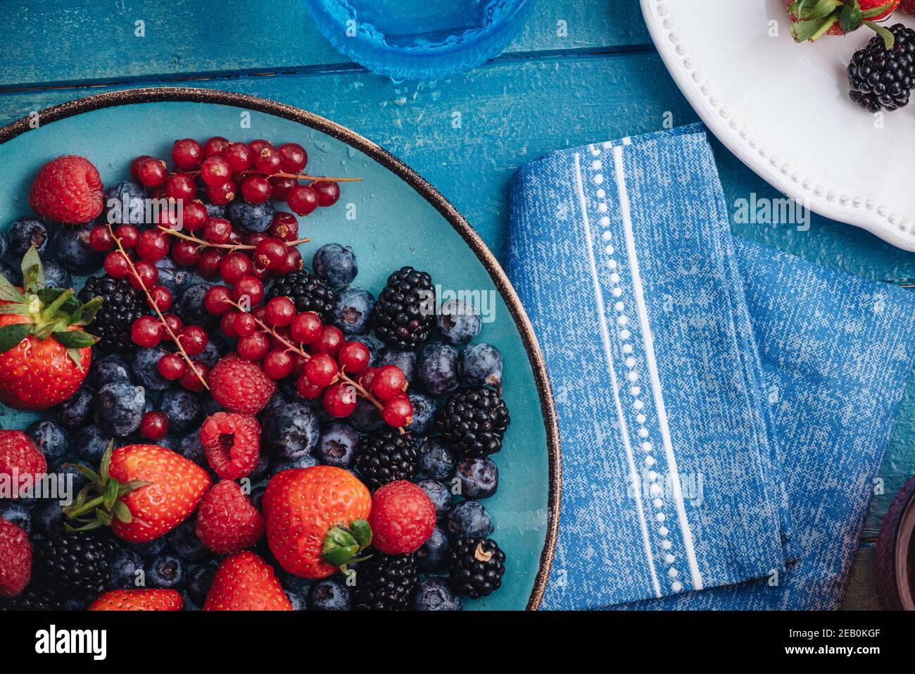 Healthy breakfast eating a mix of raw fresh berries fruits Stock Photo ...
