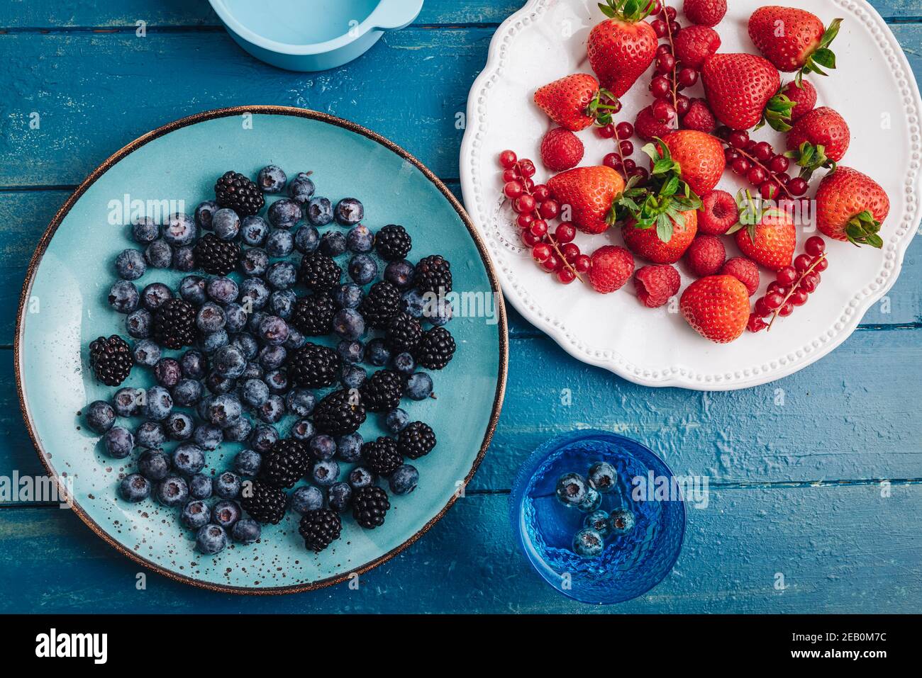 Healthy breakfast eating a mix of fresh raw berries fruits Stock Photo ...