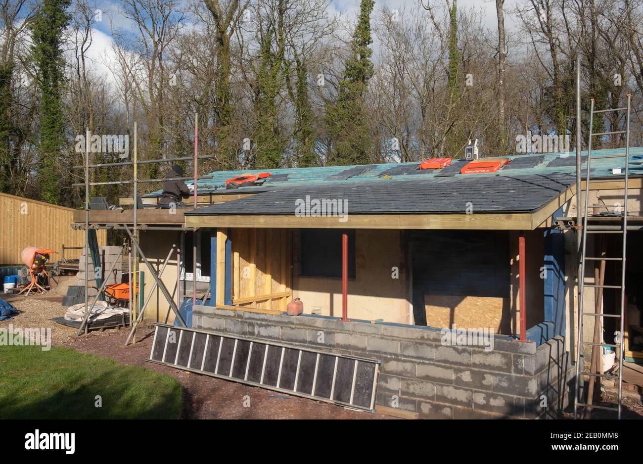 Workman Replacing a Slate Tile Roof Whilst Renovating a Building in ...