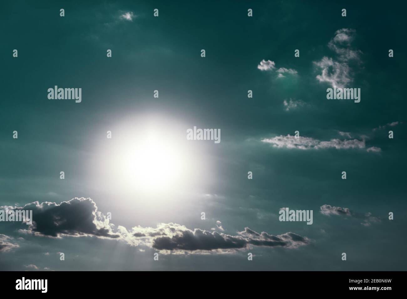 Cold bright sun with clouds on the sky Stock Photo - Alamy