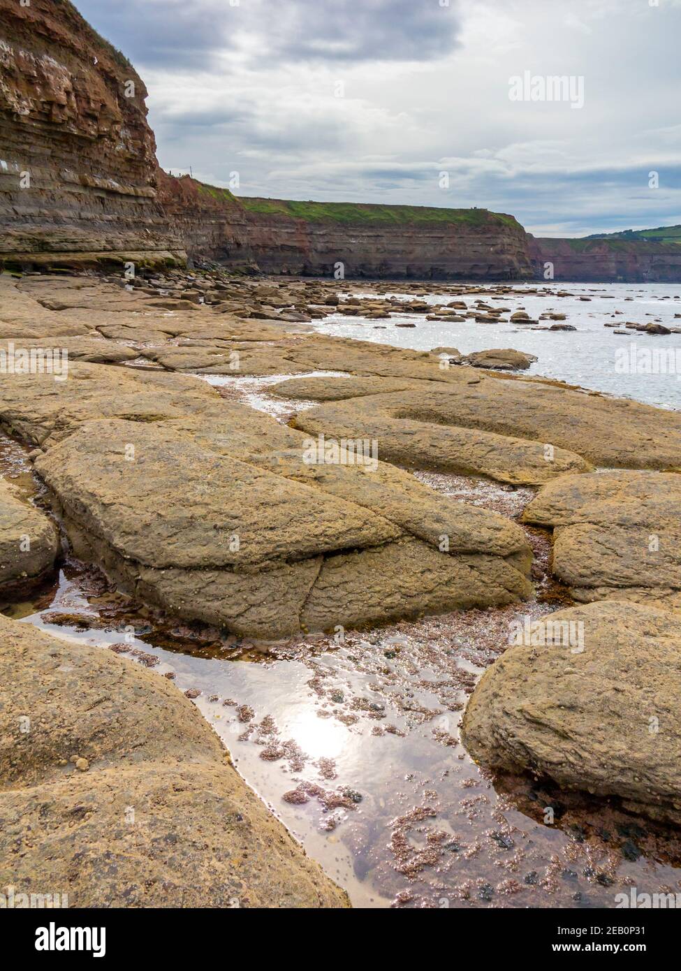 Rock pools on the beach at Staithes a village on the North Yorkshire ...