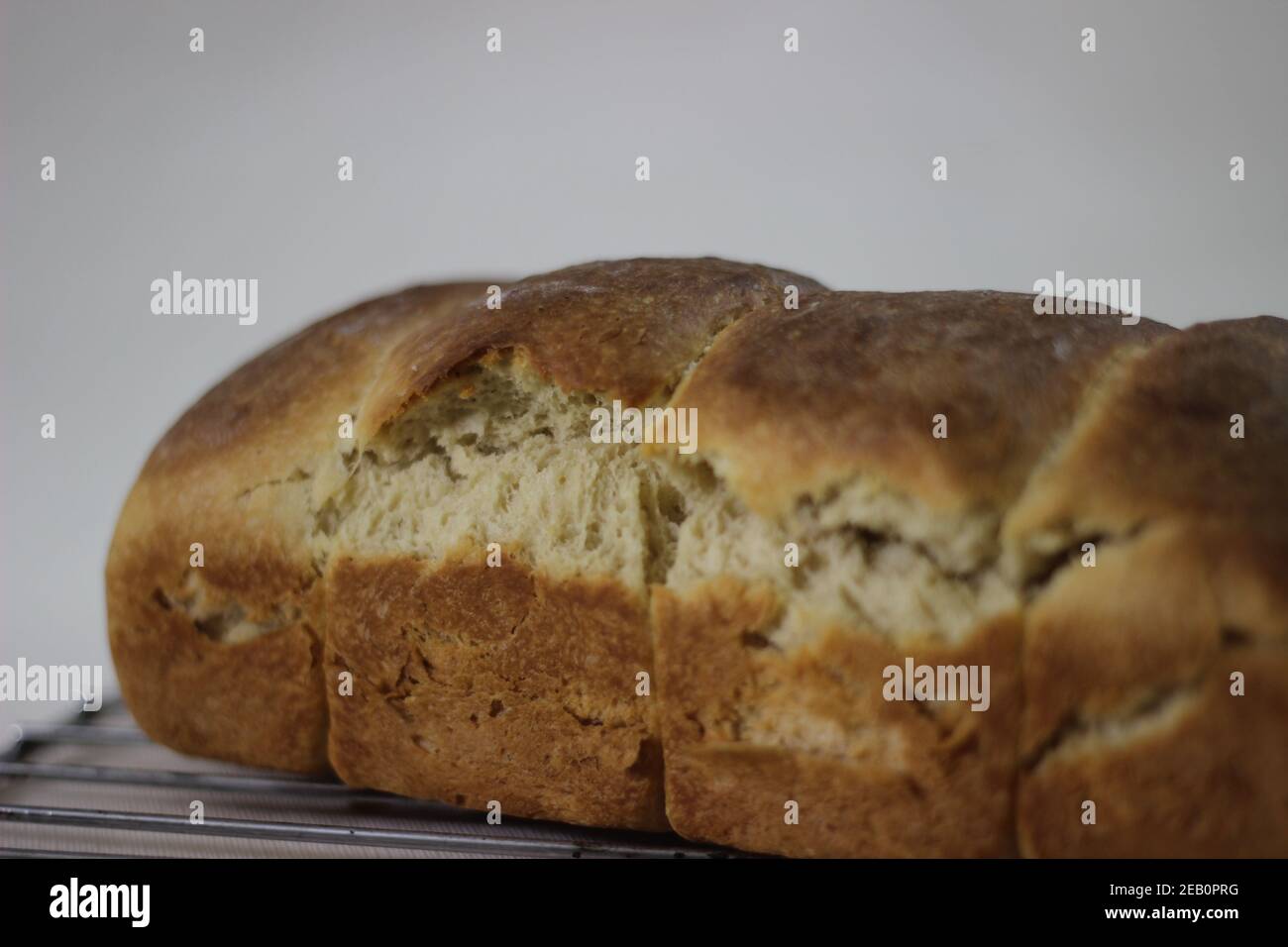Home baked mini roll loaf bread with broken bands of rolls visible ...