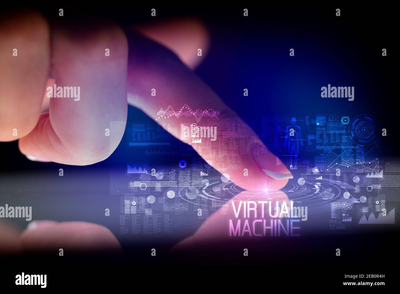 Finger touching tablet with web technology icons and VIRTUAL MACHINE ...