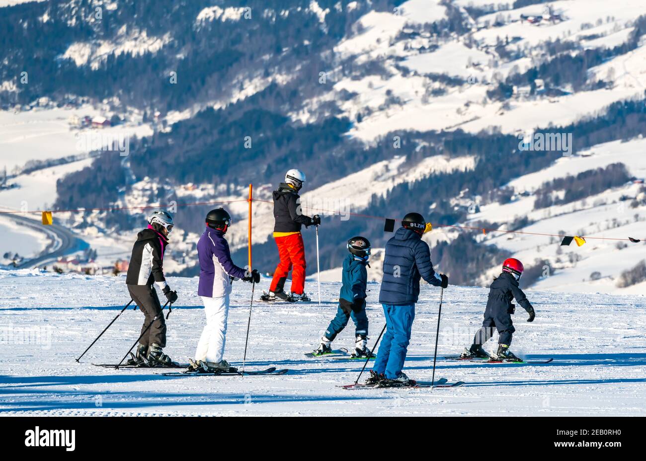 Large group of skiers together on a winter holiday in an alpine skiing ...