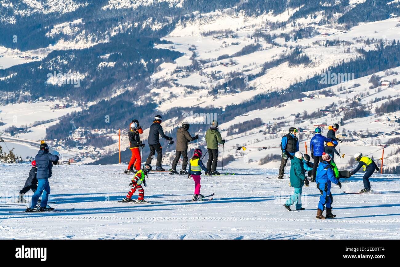 Large group of skiers together on a winter holiday in an alpine skiing ...