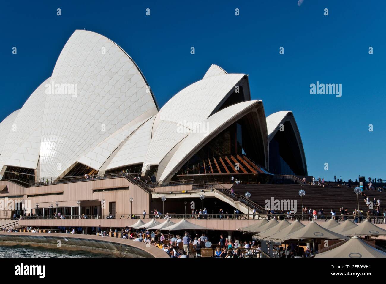 The Sydney Opera House performing arts center at Sydney Harbor, is a ...