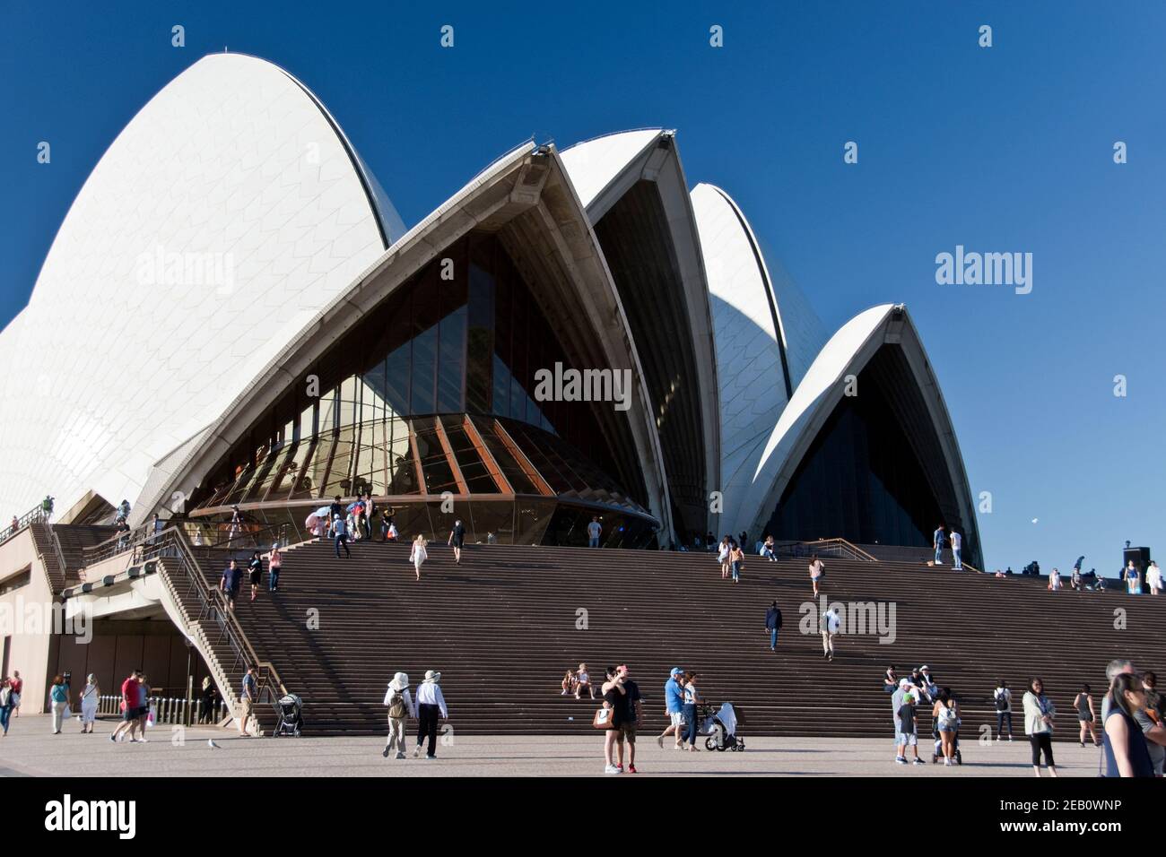 The Sydney Opera House performing arts center at Sydney Harbor, is a ...