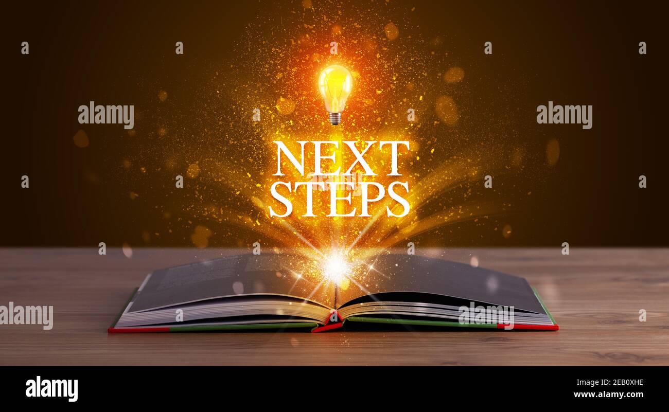 NEXT STEPS inscription coming out from an open book, educational ...