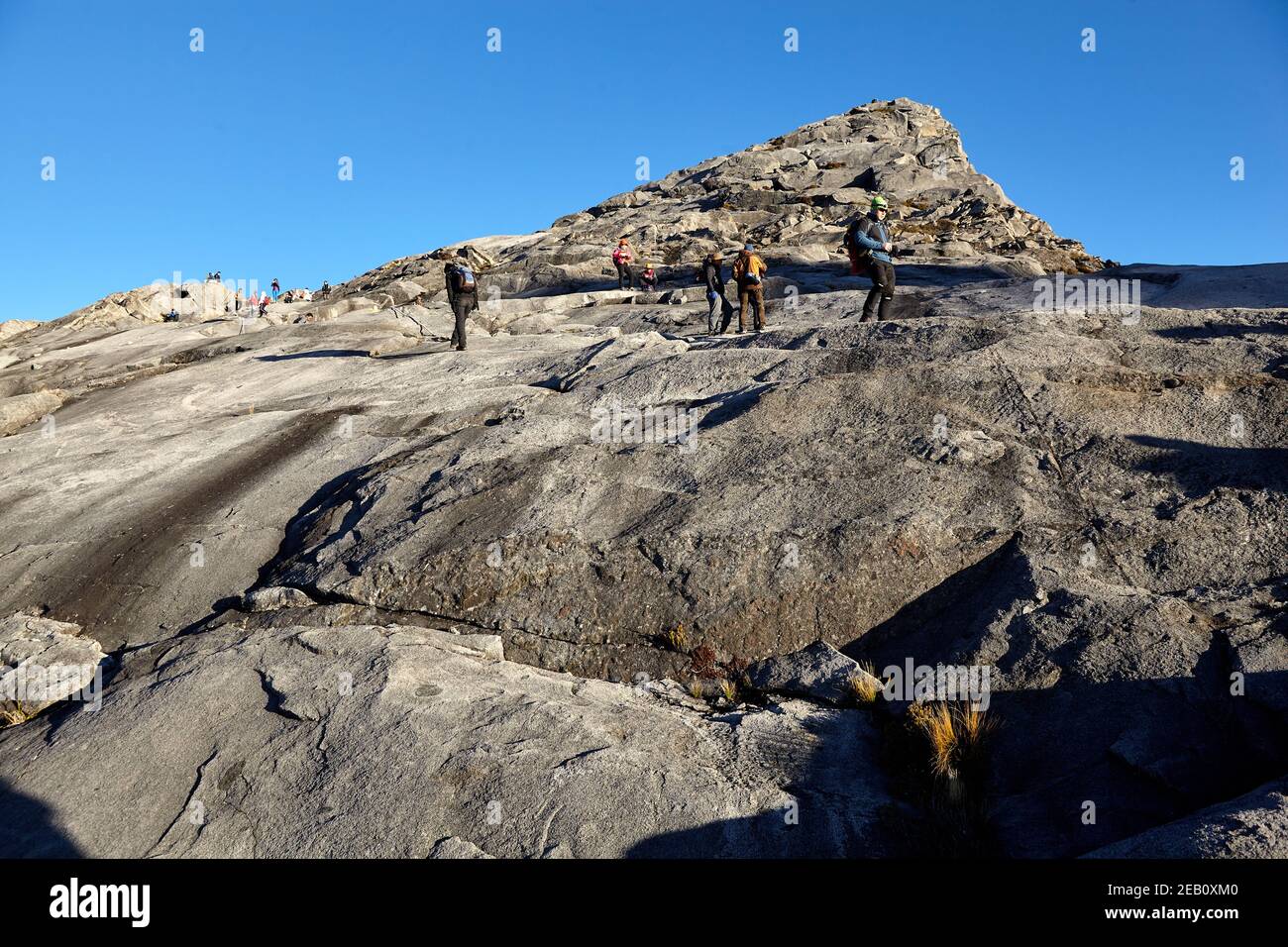 Climbers make their way down from Low’s Peak, the mountain’s highest ...