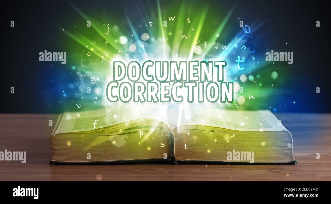 DOCUMENT CORRECTION inscription coming out from an open book ...