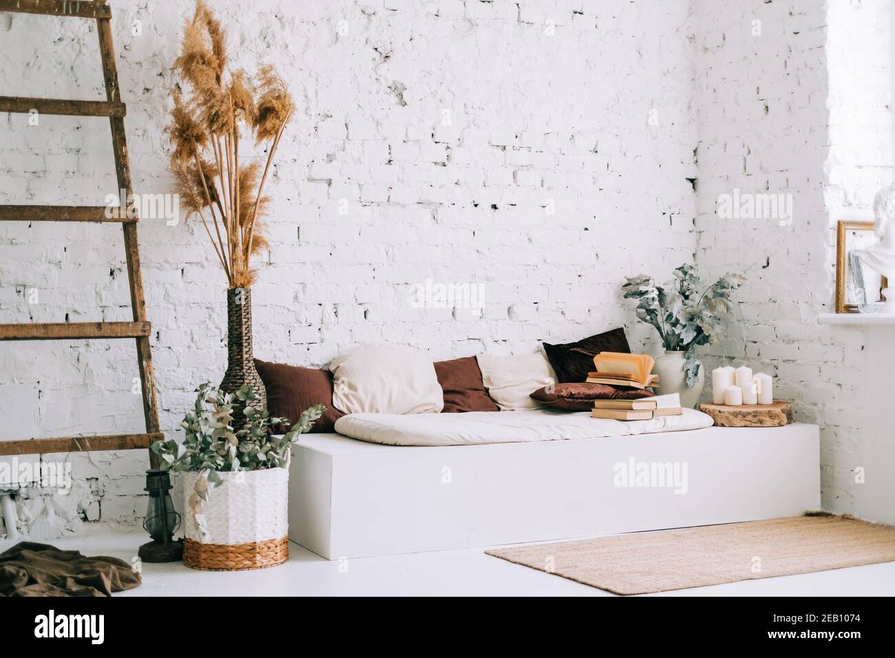 Interior design of bright living room with white walls and couch bench ...