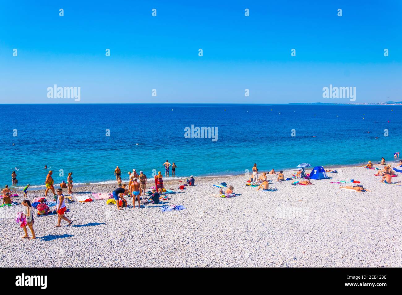 NICE, FRANCE, JUNE 11, 2017: People are enjoying summer on a beach in ...