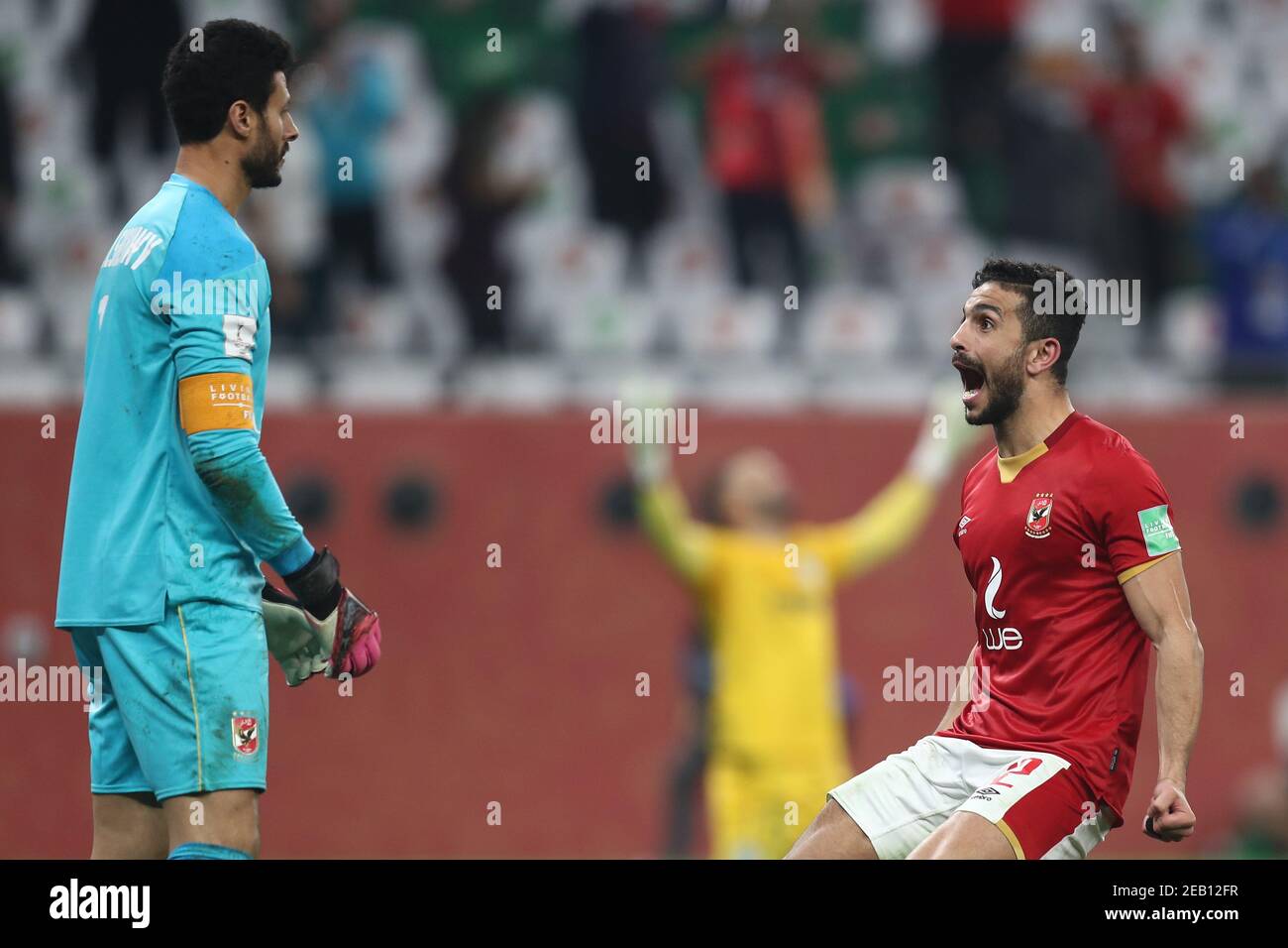 Ar Rayyan, Qatar. 11th Feb, 2021. Al Ahly's Ayaman Ashraf (R) and ...