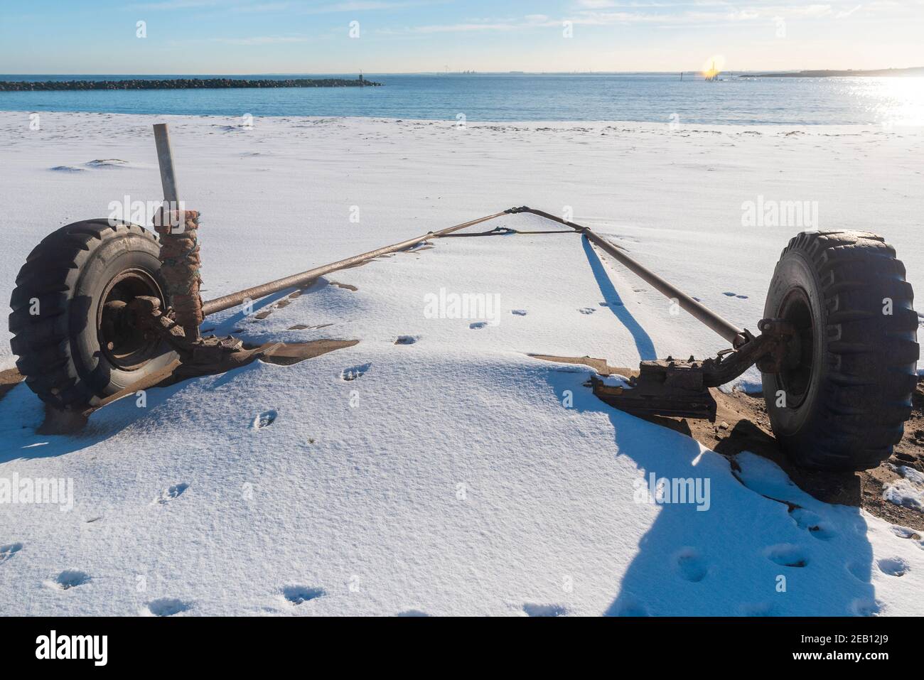 Boat trailer on Newbiggin Beach with snow Stock Photo - Alamy