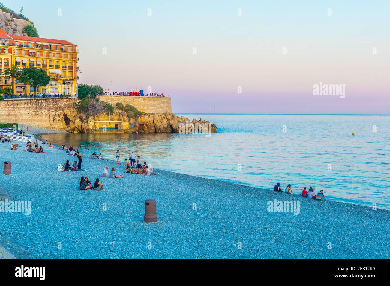 NICE, FRANCE, JUNE 11, 2017: Sunset view of people on a beach in Nice ...