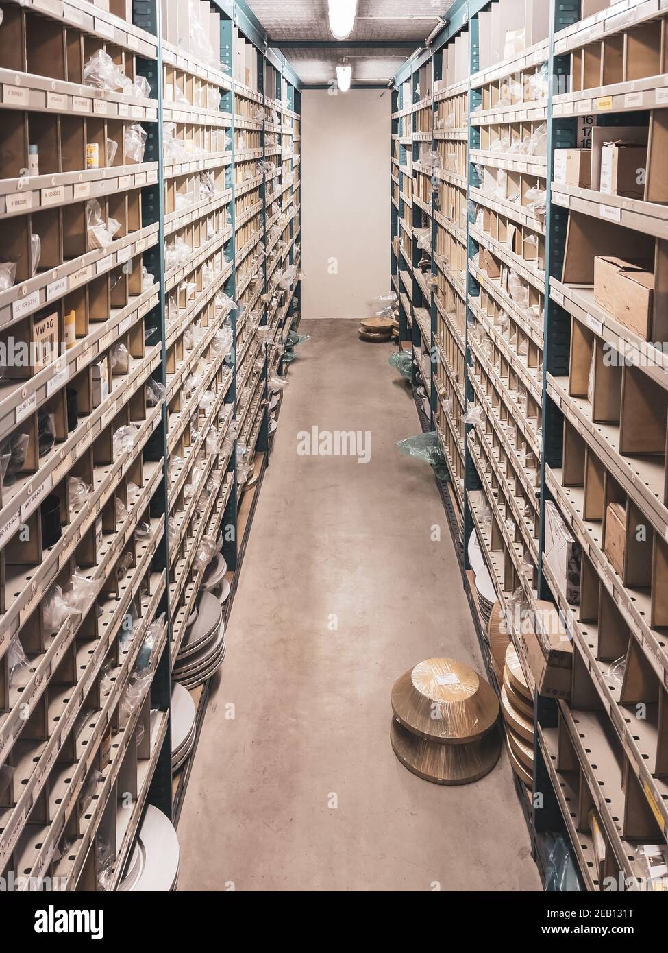 many shelves filled with spare parts stand in the parts store of the ...