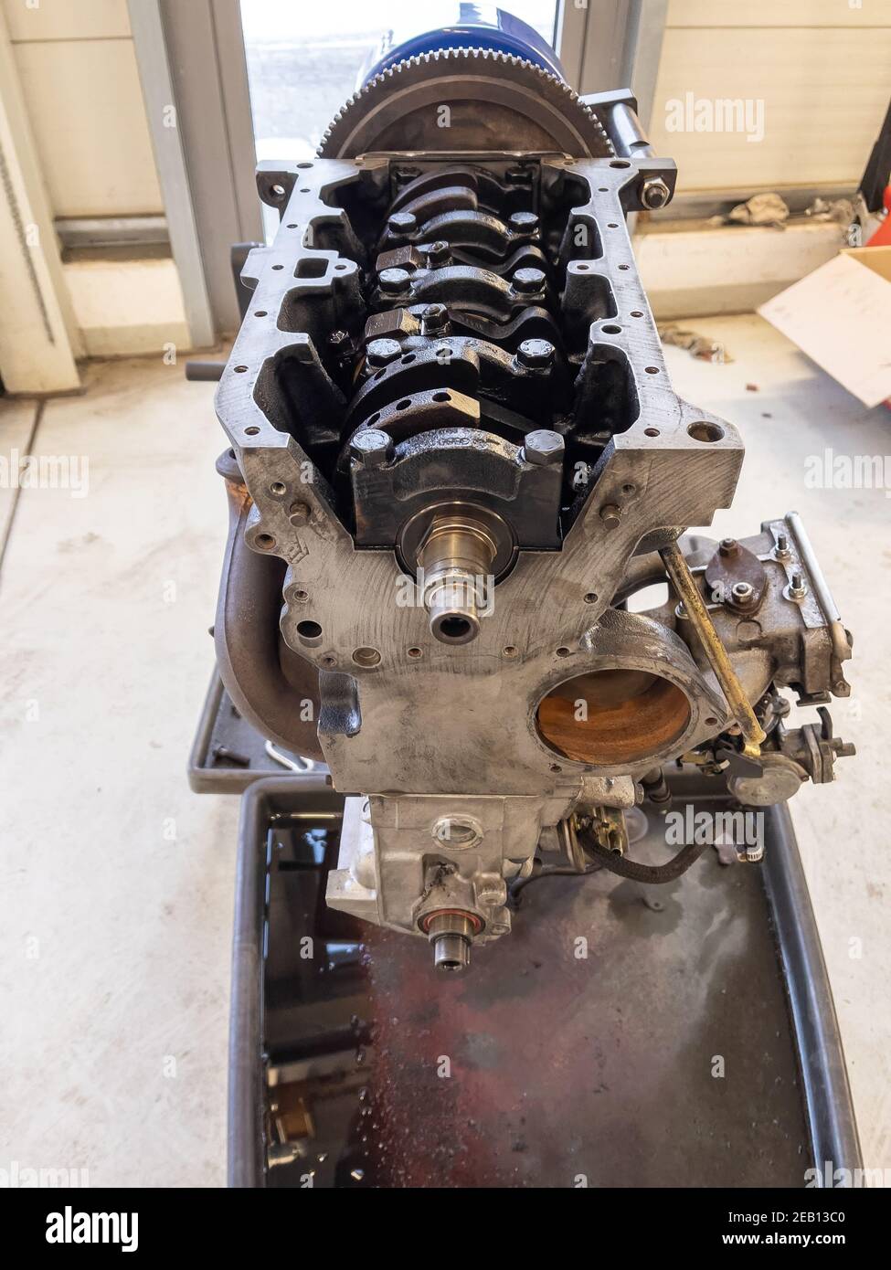 in a garage there is an opened engine block of a car Stock Photo - Alamy
