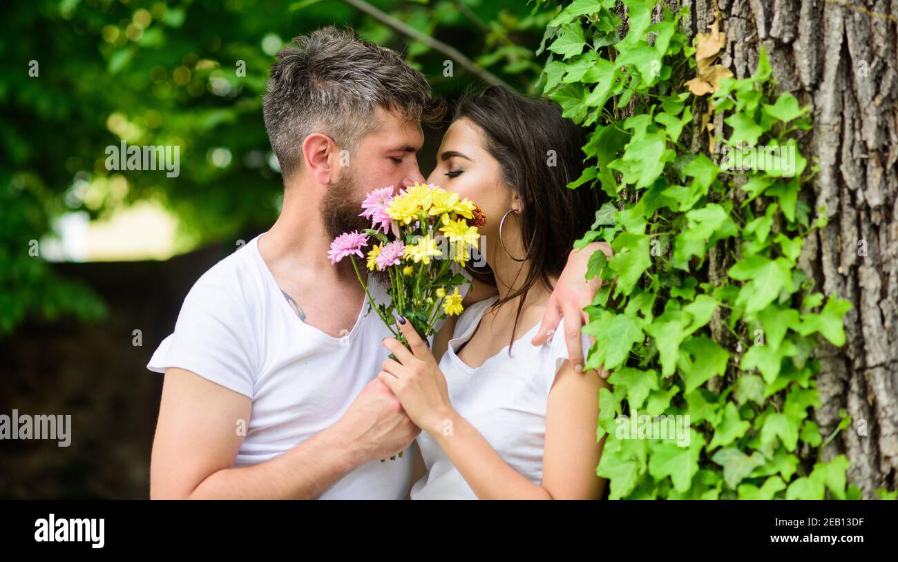 Man bearded hipster kisses girlfriend. Secret romantic kiss. Moment of intimacy. Couple in love ...