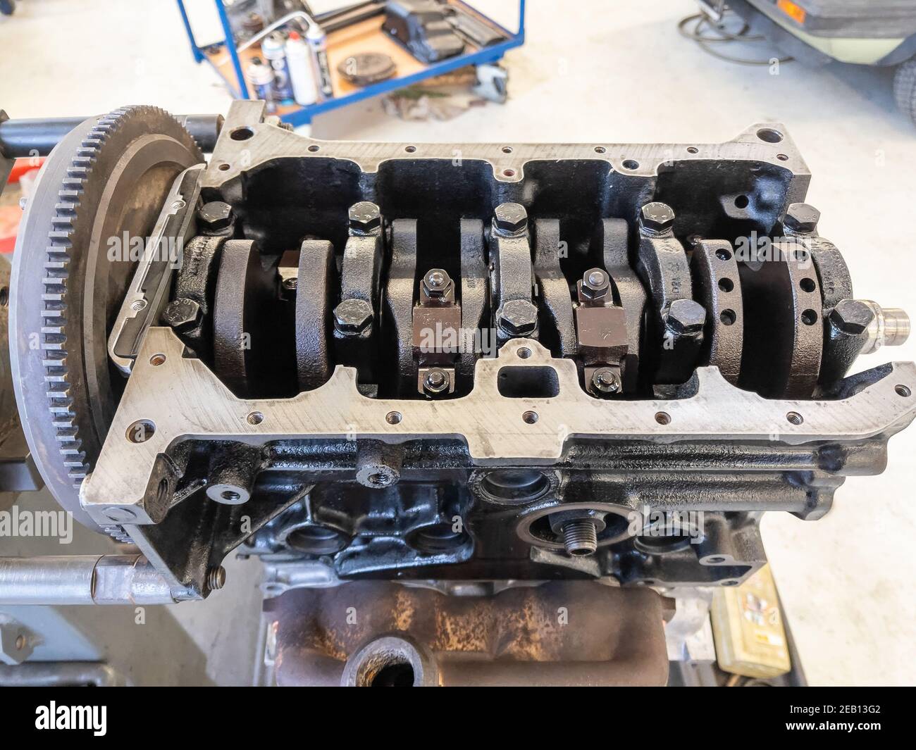 in a garage there is an opened engine block of a car Stock Photo - Alamy
