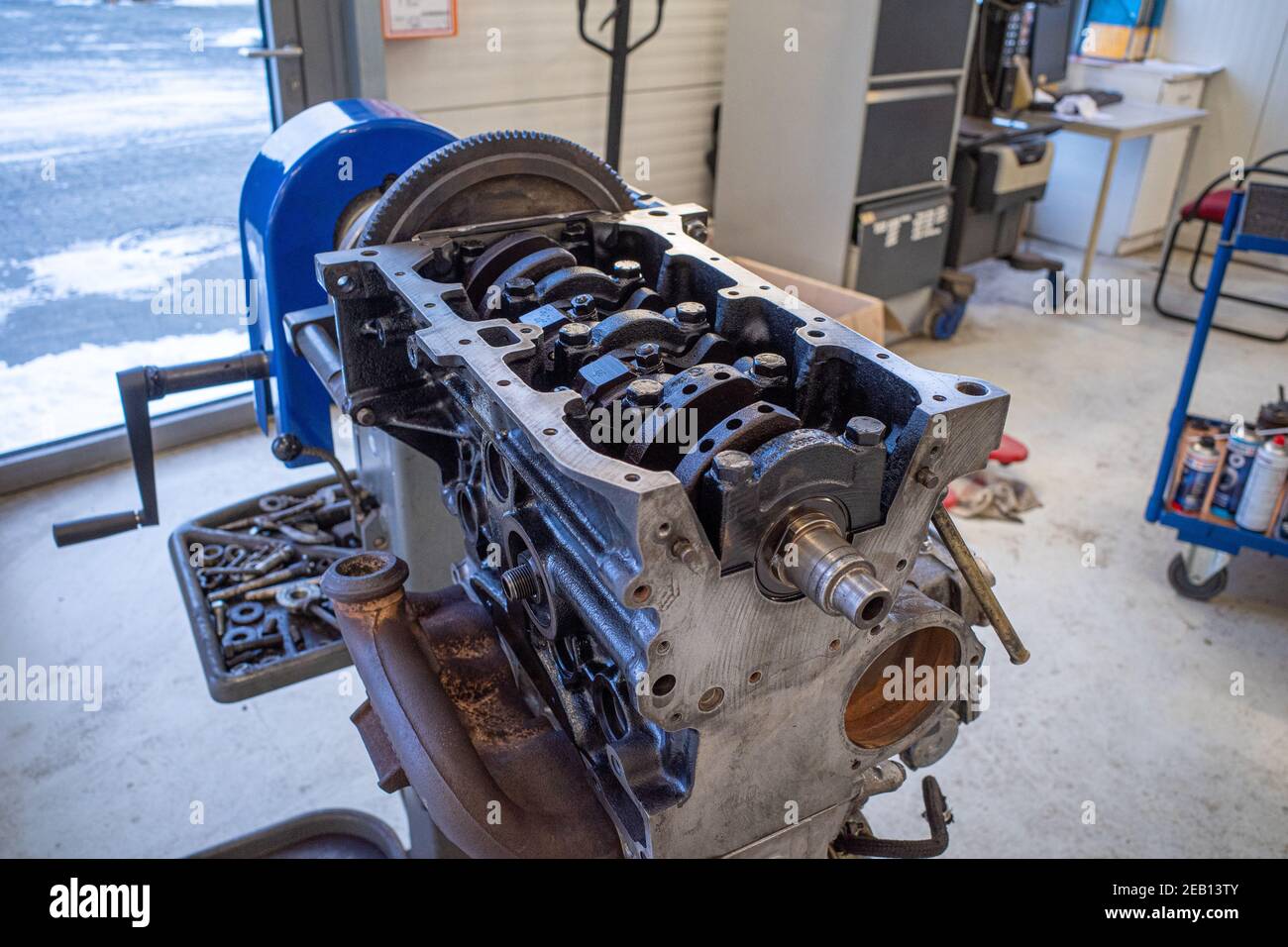 in a garage there is an opened engine block of a car Stock Photo - Alamy