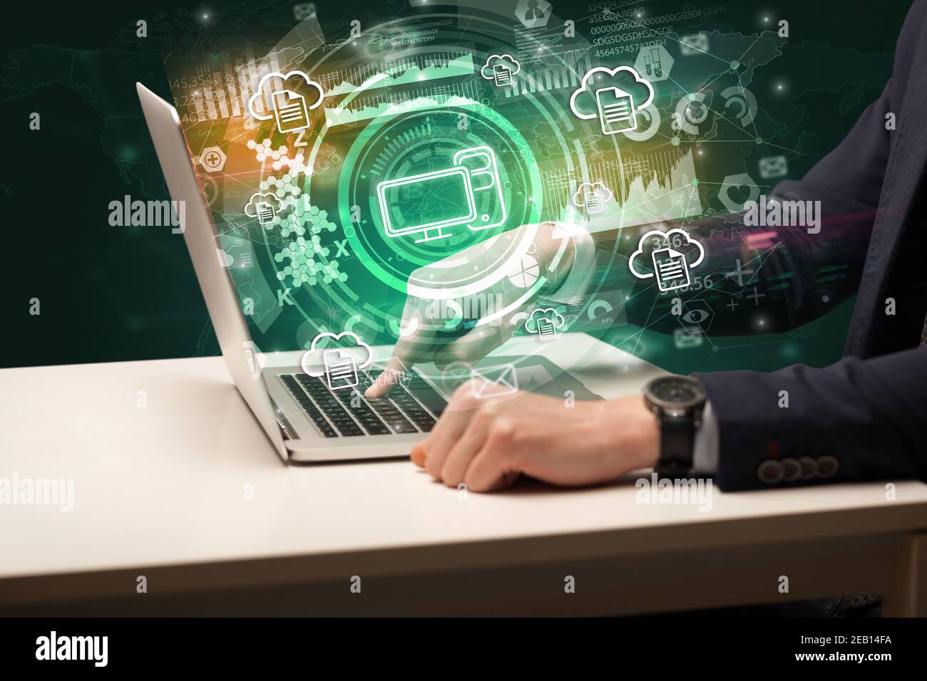 Business hand typing on a modern laptop with personal computer icon ...